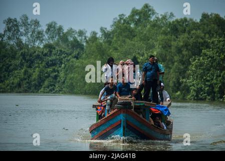 Residents are seen riding water transportation at the Batang Buluh pier ...