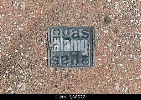 Gas manhole cover in pavement Stock Photo - Alamy