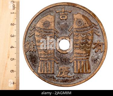 Most ancient Chinese copper coin with a hole. Isolated on white Stock ...