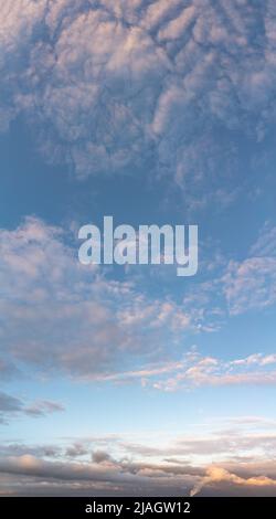 Fantastic clouds at sunrise, vertical panorama Stock Photo - Alamy