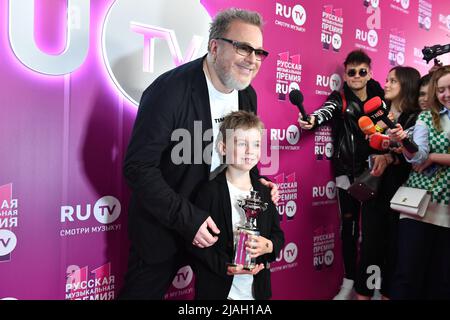 Moscow. The singer Vladimir Presnyakov Jr. with the son at a ceremony ...