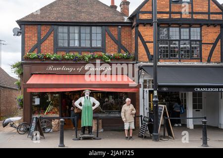 shops on cranleigh village high street surrey Stock Photo - Alamy