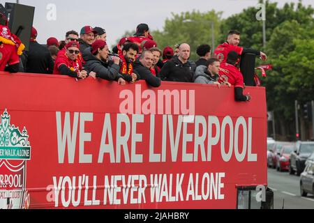 The Liverpool FC squad look on during the open top bus parade through ...
