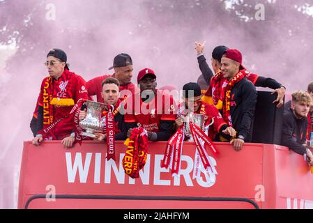 Liverpool players on an open-top bus during the trophy parade in ...