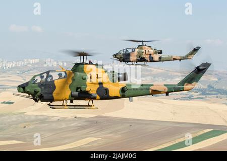 A Bell AH-1 Cobra attack helicopter with its XM197 20mm cannon under ...