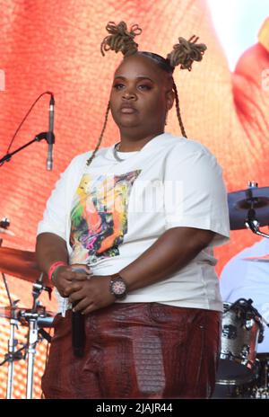 Poet, rapper, and educator, Oompa is shown performing on stage during a ...