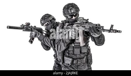 Two SWAT team fighters in black uniforms, armed with assault rifles ...