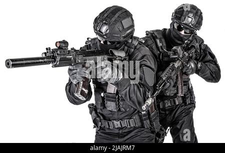 Two SWAT team fighters in black uniforms, armed with assault rifles ...