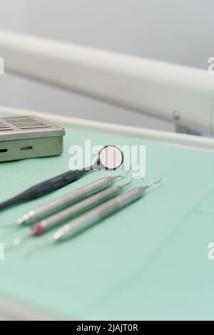 Dental Instruments arranged on white table Stock Photo - Alamy