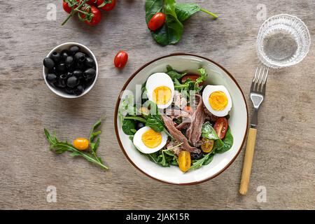 French composed salad with tuna, anchovy, hard-boiled eggs, tomatoes ...