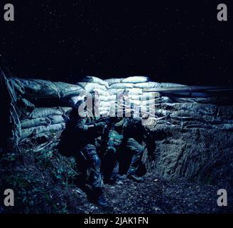 Special forces soldiers with weapon take part in military maneuver. war ...