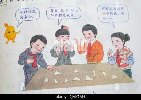 On the inner page of the textbook, there is an illustration of a little ...