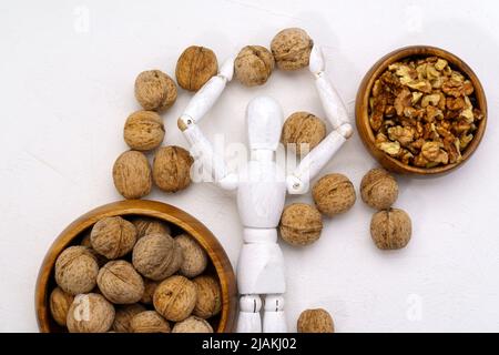 The human brain is shaped like a walnut kernel. Wooden mannequin with ...