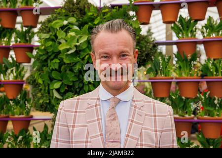 Renowned florist, author and presenter, Simon Lycett, with his display ...