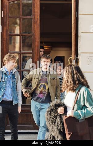 Group of students walking through a school hallway Stock Photo - Alamy