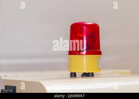 Red Dome Warning Rotating Light at Top of Machine Stock Photo - Alamy