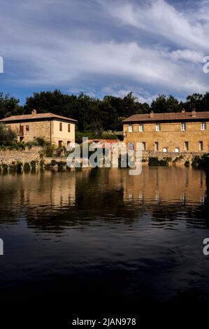 Buildings in honey-coloured Tuscan stone surround the 16th century Bath ...