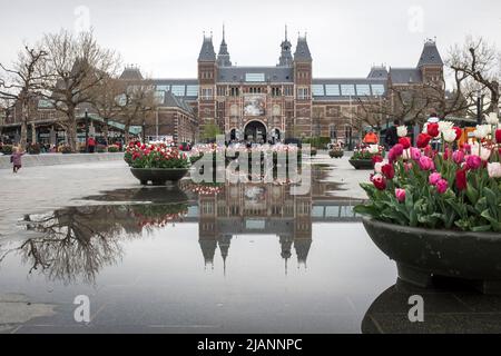 A reflection of The Rijksmuseum in a puddle after the rain, in ...