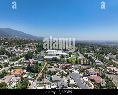 Aerial view of wealthy Alta Loma community and mountain range, Rancho ...