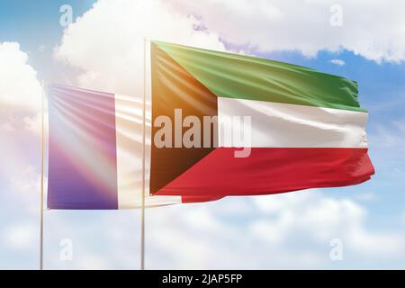 Kuwait and France flags waving together on blue cloudy sky, two country ...