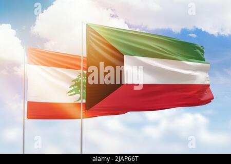 Kuwait and Lebanon flags waving together in the wind on blue cloudy sky ...