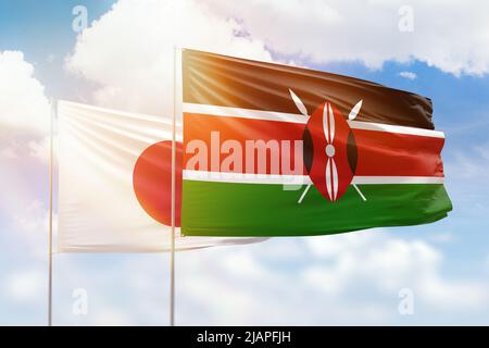 Japan and Kenya flags waving together on blue cloudy sky, two country ...