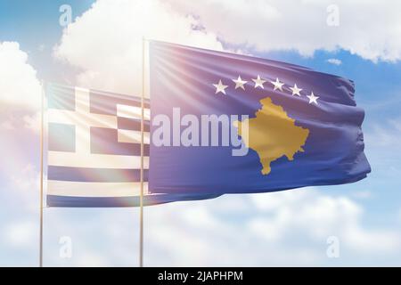 Sunny blue sky and flags of greece and oman Stock Photo - Alamy