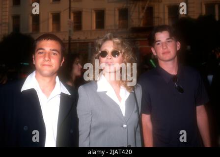 Actress Faye Dunaway and her son Liam, center, talk with Diddy, right ...