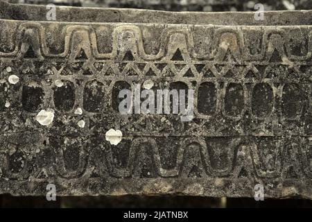 Megalithic carving on a tomb in traditional village of Pasunga in ...