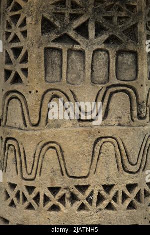 Megalithic carving on a tomb in traditional village of Pasunga in ...