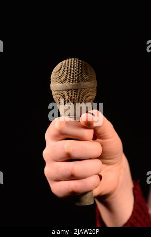 girl holding dirty microphone Stock Photo - Alamy