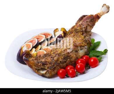 Baked shoulder of mutton with figs, tomatoes, soft cheese Stock Photo ...