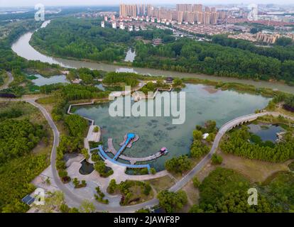 HUAI'AN, CHINA - JUNE 1, 2022 - Trees cover the ancient Huai River ...