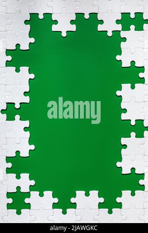 Framing in the form of a rectangle, made of a white jigsaw puzzle ...