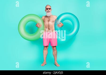 Photo of confident guy hold two chemical tube wear goggles gloves khaki ...