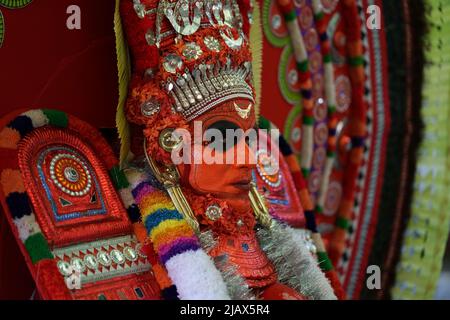 Theyyam is a famous ritual art form in kerala with face painted using ...