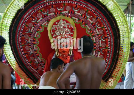 Theyyam is a famous ritual art form in kerala with face painted using ...