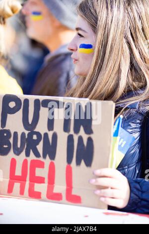 Participants gather during a Stand With Ukraine protest against Russia ...