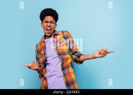 Photo of funky charming dark skin man wear black sweater dancing ...