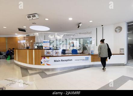 Reception desk at British NHS hospital Stock Photo - Alamy