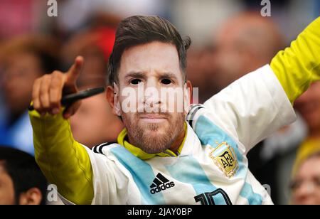 An Argentina wears a Lionel Messi mask prior to the FIFA World Cup ...