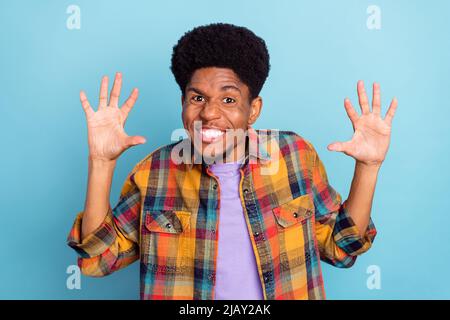 Photo of impressed funny dark skin guy dressed checkered shirt dancing ...
