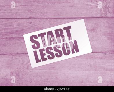 Start lesson words on card on wooden table. Education concept Stock ...