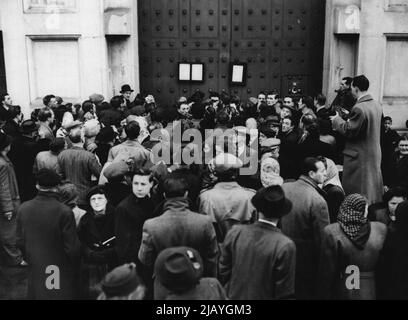 Daniel Raven Hanged - A crowd of people press forward to read the ...