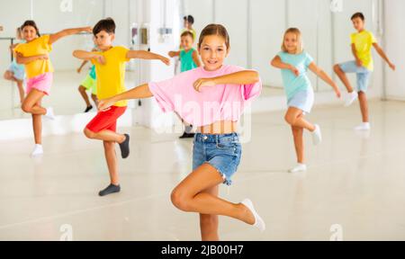 Active children dancing modern dances in choreographic studio Stock ...