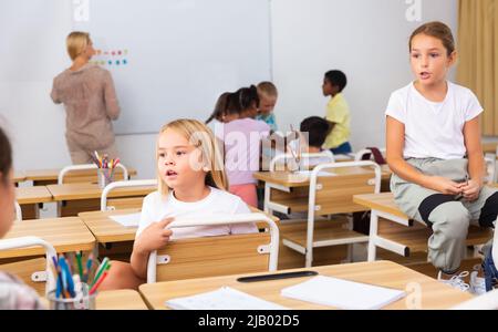 Kids pupils talking during recess between lessons Stock Photo - Alamy