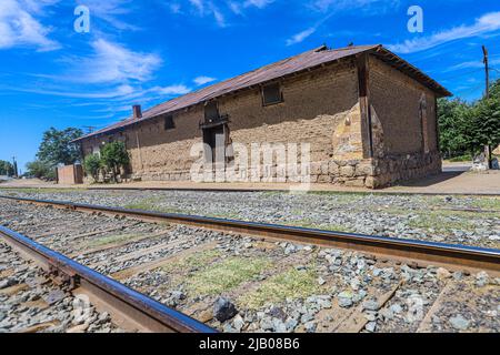 Train tracks, railway and old adobe train station in Esqueda, Mexico ...