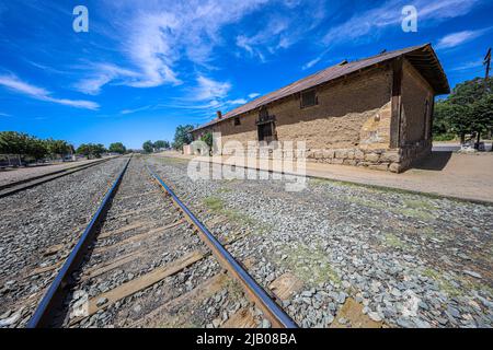 Train tracks, railway and old adobe train station in Esqueda, Mexico ...