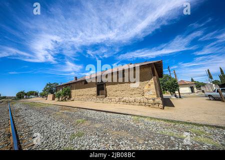 Train tracks, railway and old adobe train station in Esqueda, Mexico ...