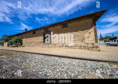 Train tracks, railway and old adobe train station in Esqueda, Mexico ...